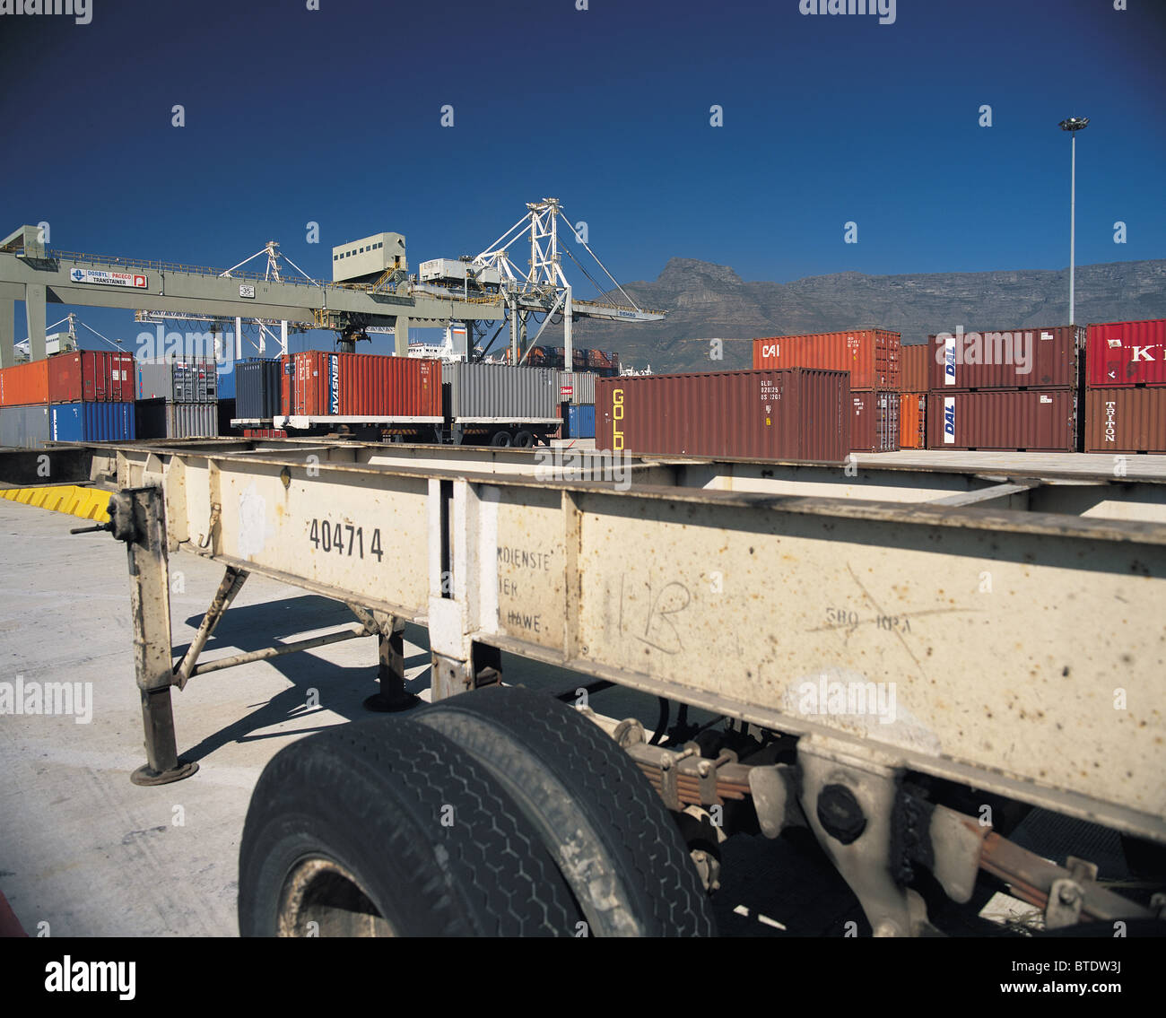 Containers are off loaded onto the pier where they are transported by ...