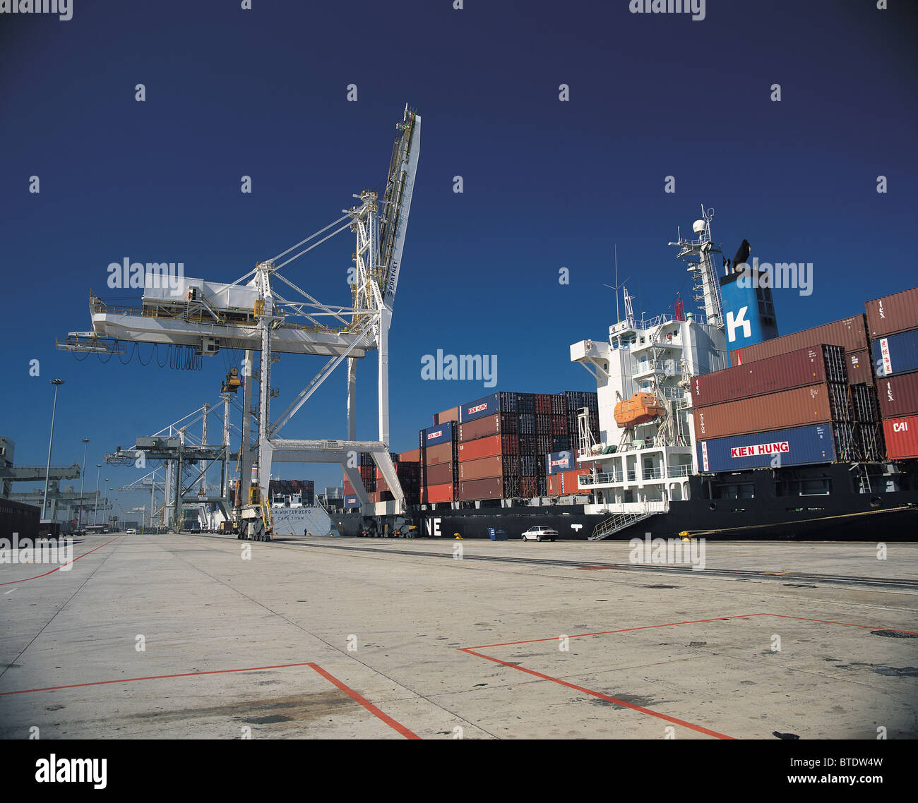 A container ship has been loaded and waits to leave the wharf Stock ...