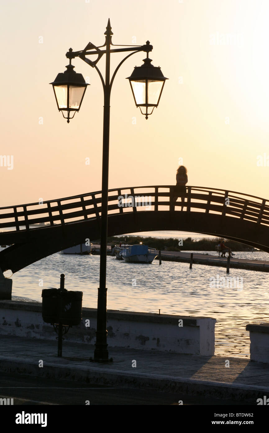 person on bridge at sunset silhouette Lefkada Lefkas Greece Stock Photo ...