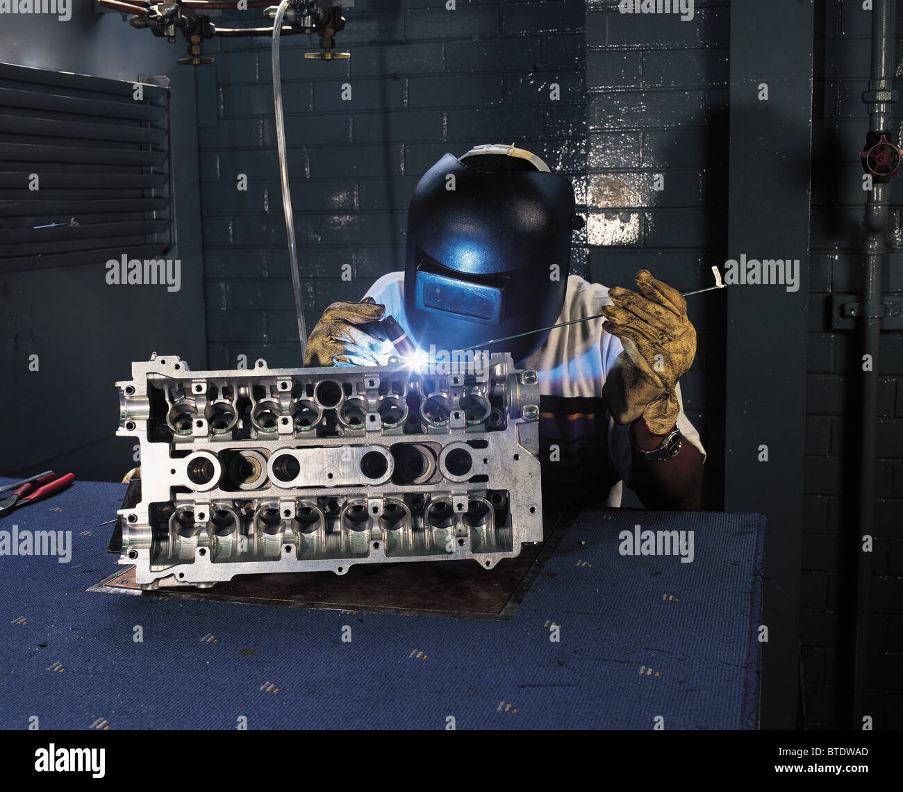 Engine block being welded by a tradesman Stock Photo - Alamy
