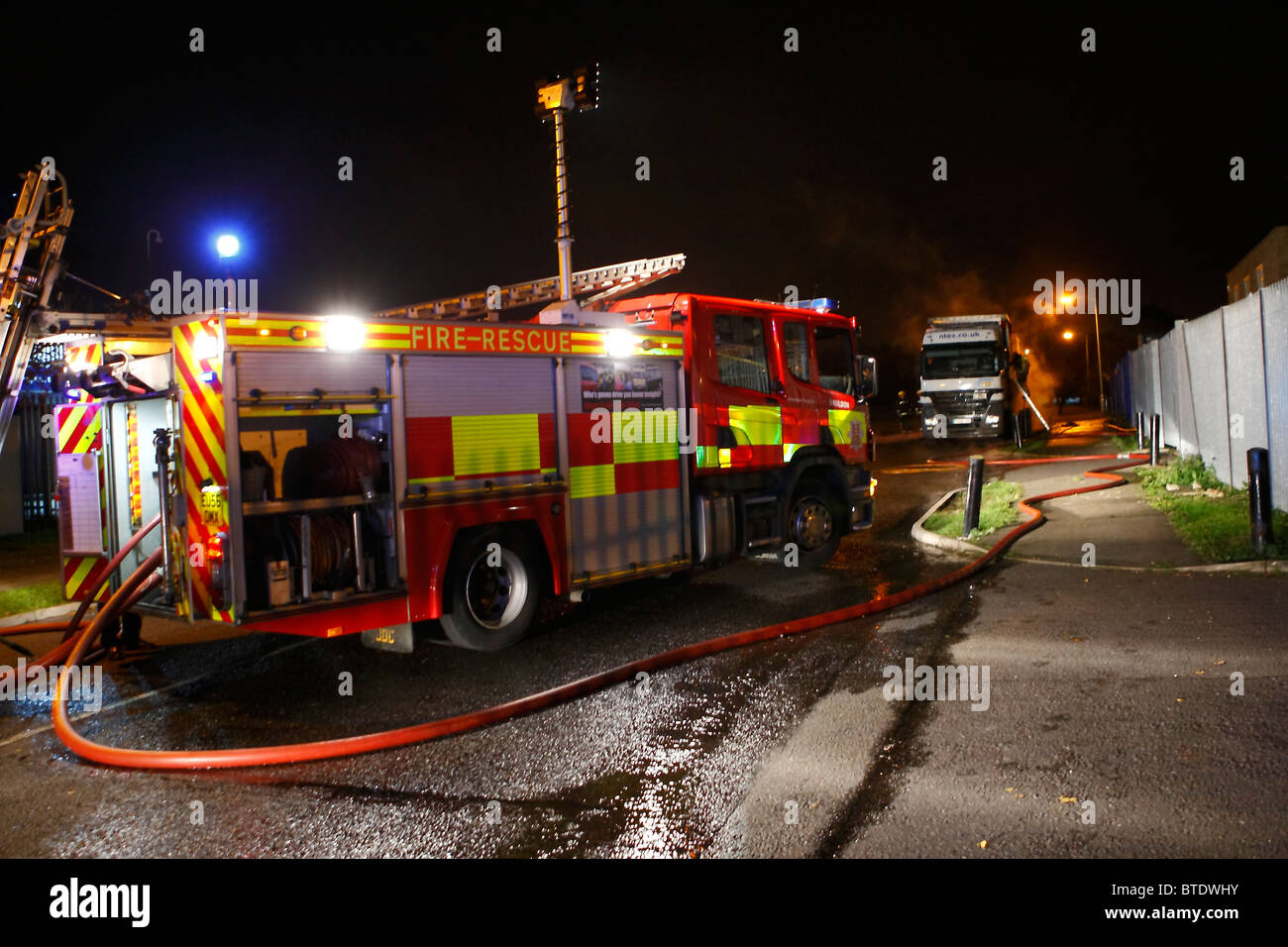 Fire engine at nigt tiem incident Stock Photo - Alamy