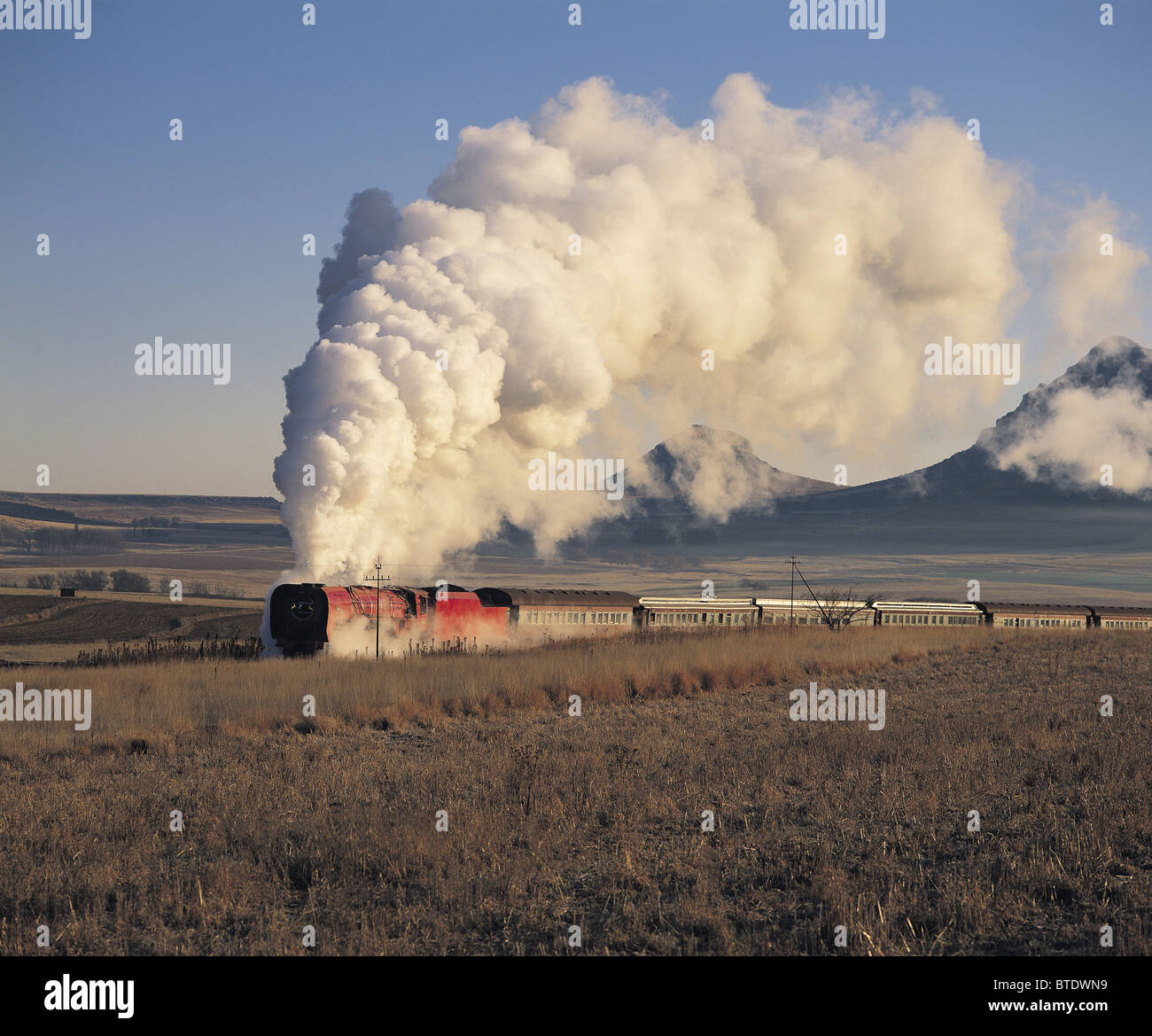 A steam train winding its way through the countryside Stock Photo - Alamy