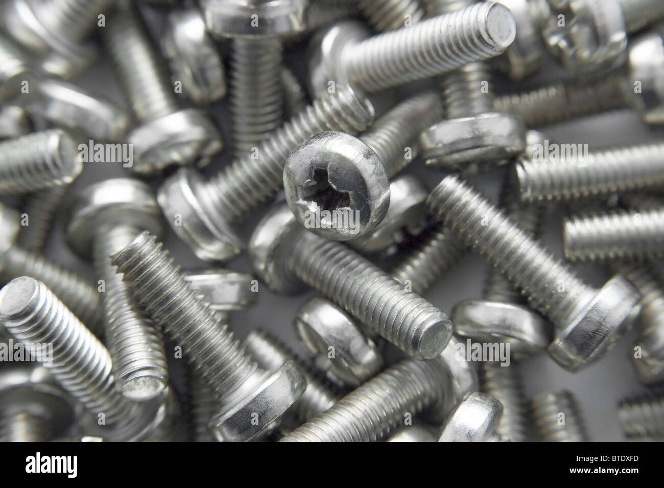 Close-up photography of a bunch of screws as background Stock Photo - Alamy