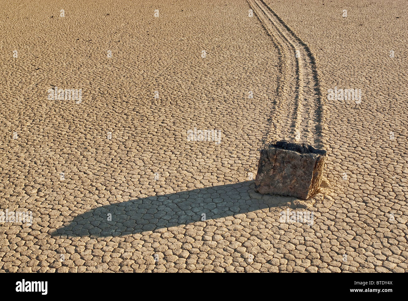 Moving rocks at The Racetrack dry lake, Mojave Desert in Death Valley ...