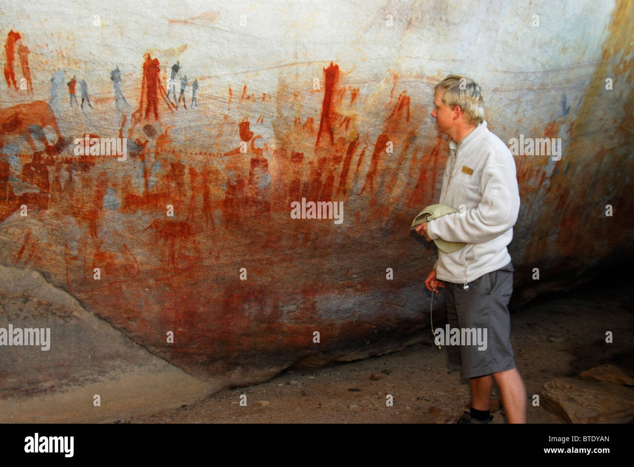 Guide showing bushman rock paintings Stock Photo - Alamy