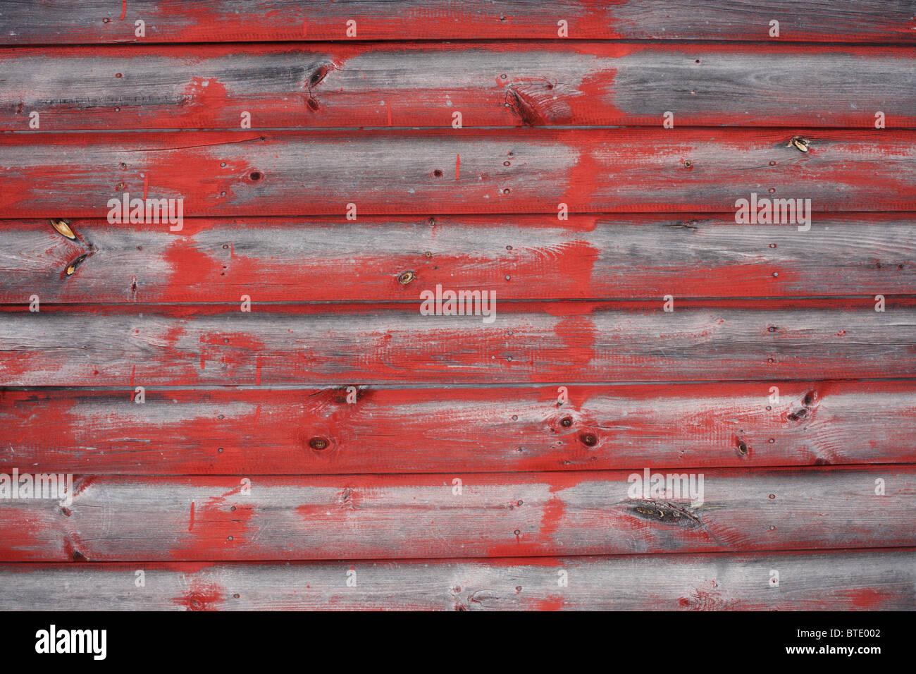 Some old wood siding with splotches of red paint Stock Photo - Alamy