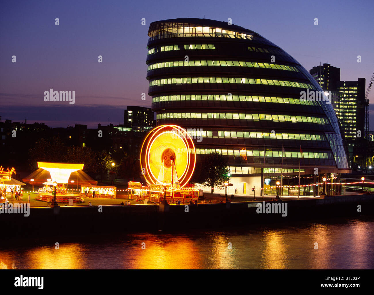 London Assembly Building & Funfair, Night Stock Photo - Alamy