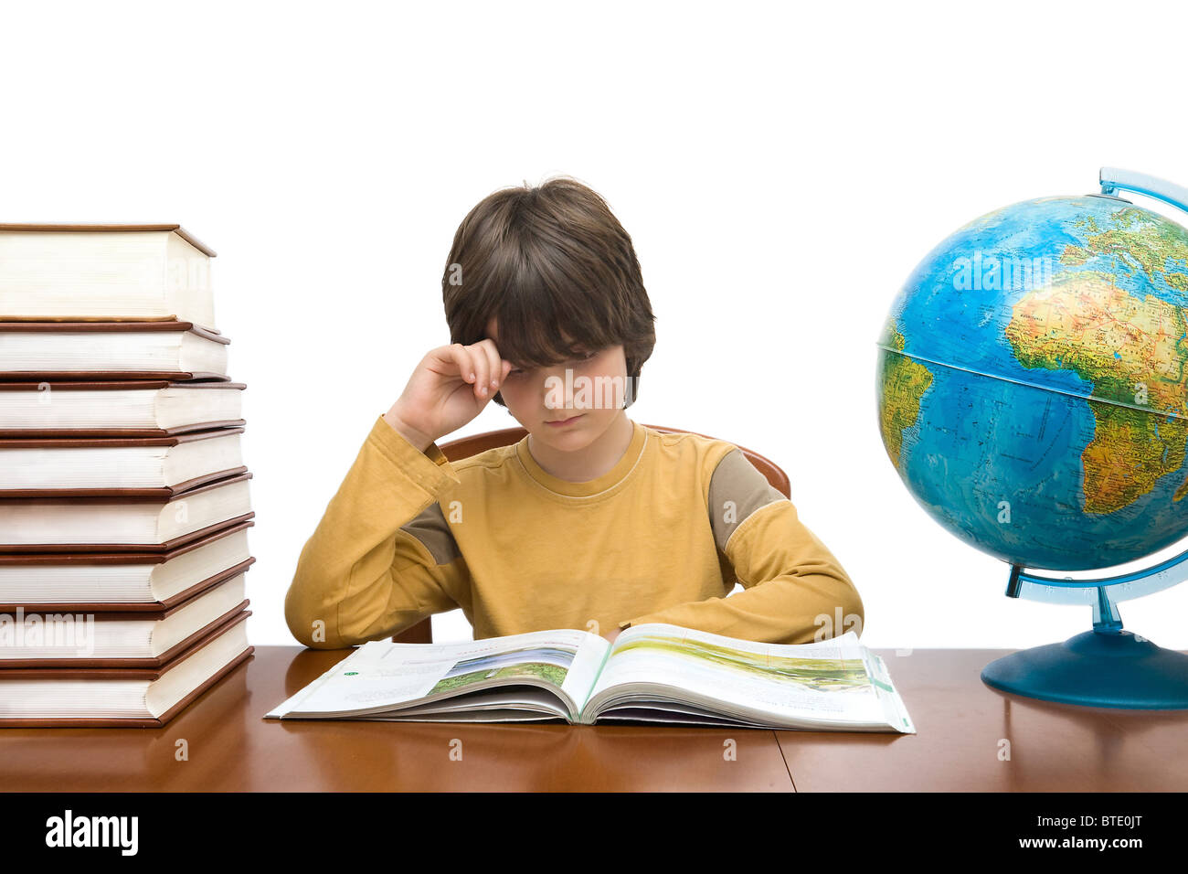 Boy studying and doing homework Stock Photo - Alamy