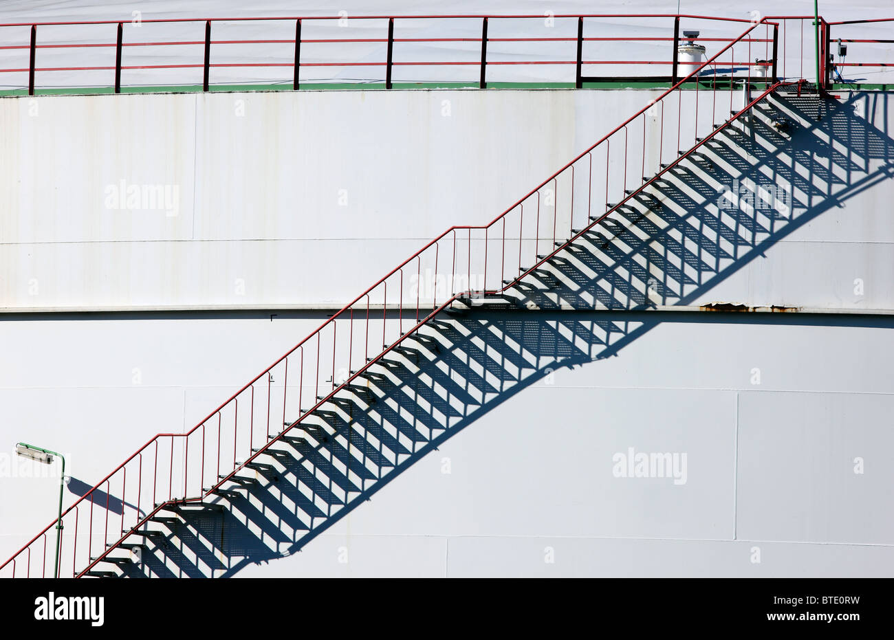 Staircase of a big oil tank in a refinery Stock Photo - Alamy