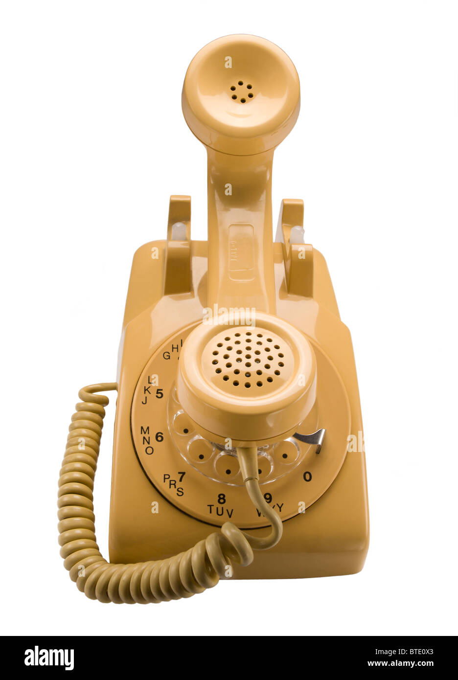 Old yellow dial telephone Stock Photo - Alamy