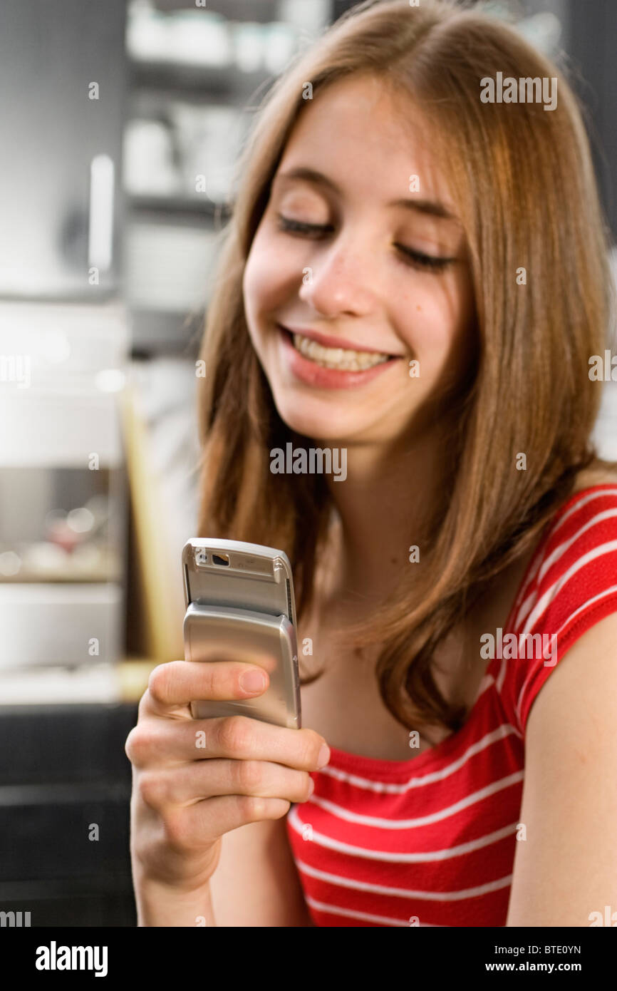 Female teenager receiving sms Stock Photo - Alamy