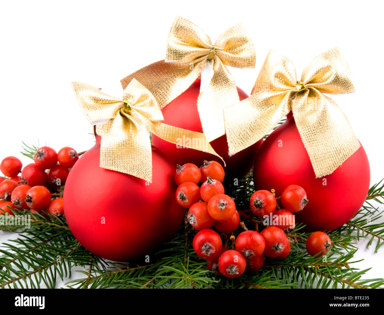 Three red glass balls with nice golden ribbons, rowan and fresh spruce ...