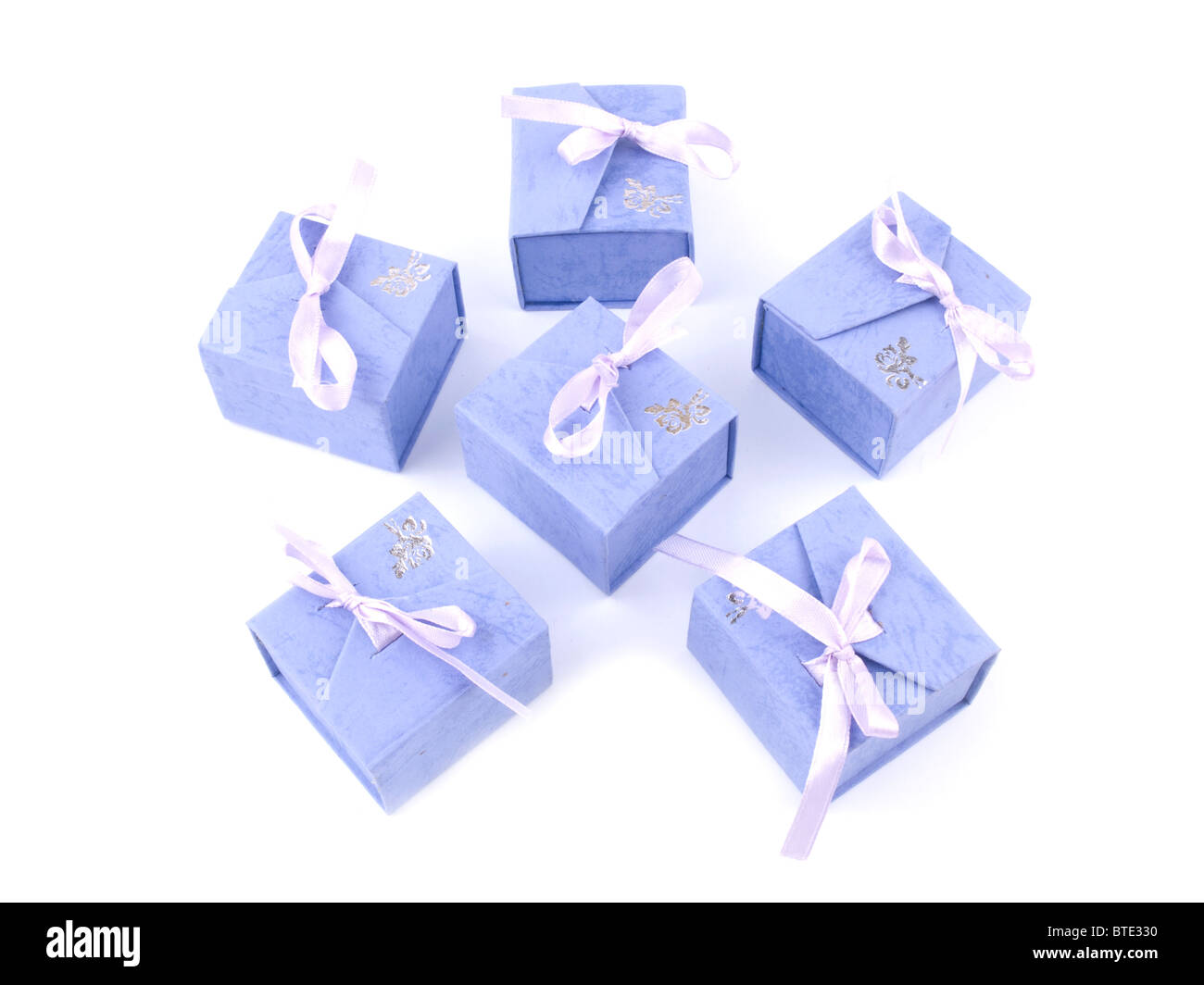 Six small lilac gift boxes on white background Stock Photo - Alamy