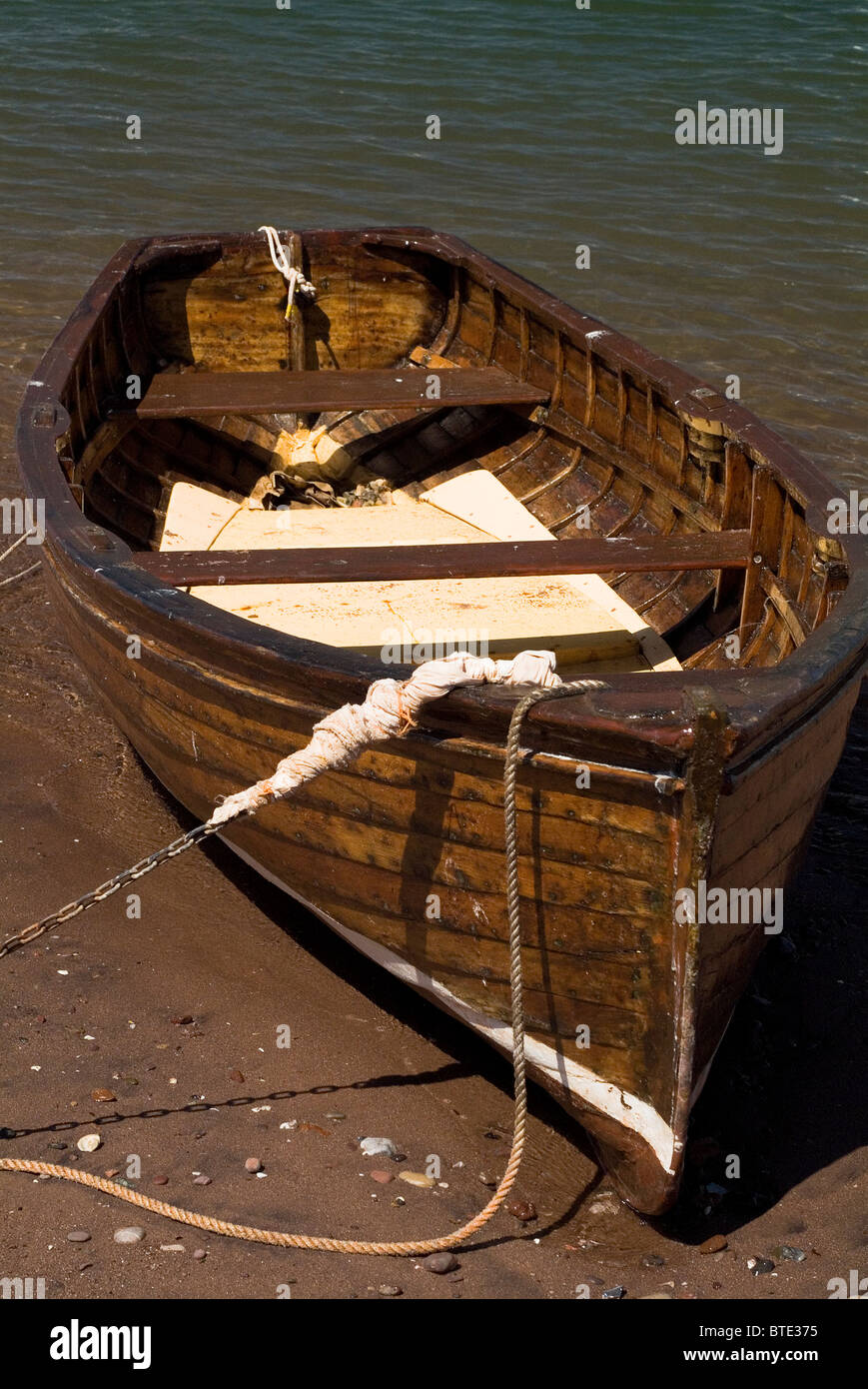 old wooden rowing boat on beach Stock Photo - Alamy