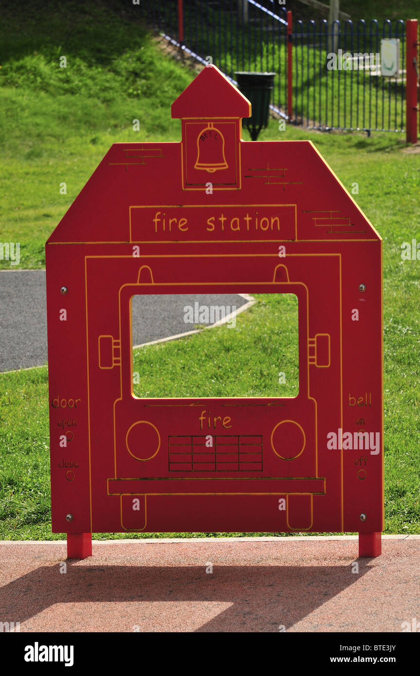 Children's play ground wooden cut out red fire station Stock Photo - Alamy