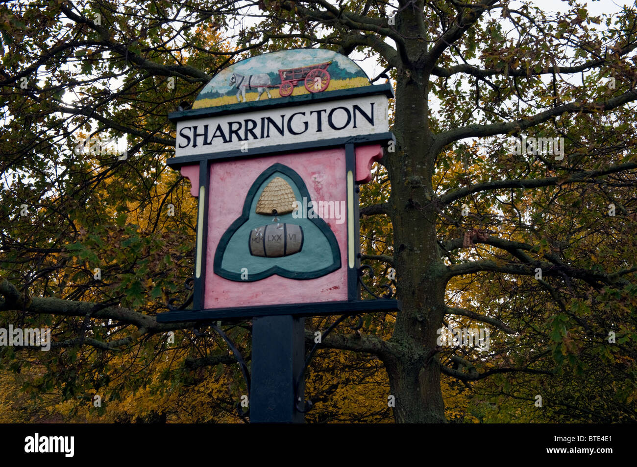 Sharrington village sign Stock Photo - Alamy