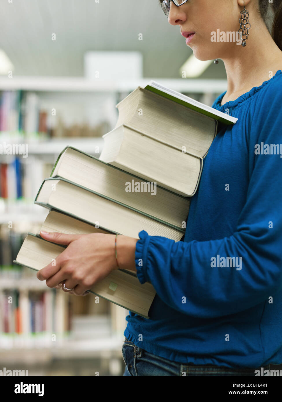 Mid adult woman books library hi-res stock photography and images - Alamy