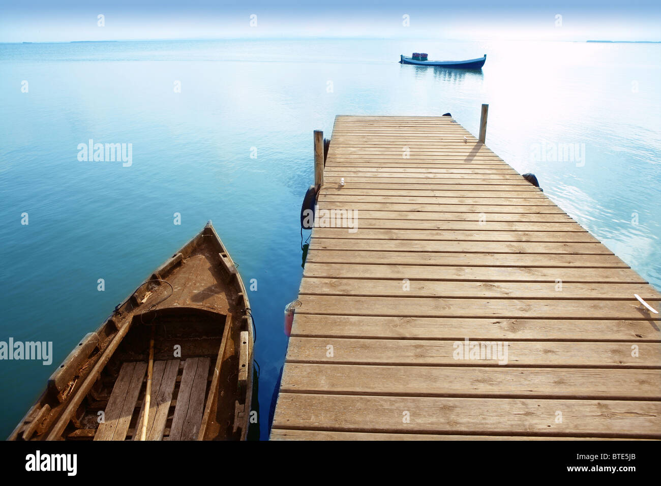 Albufera lake wetlands pier with boat in Valencia Spain Stock Photo - Alamy