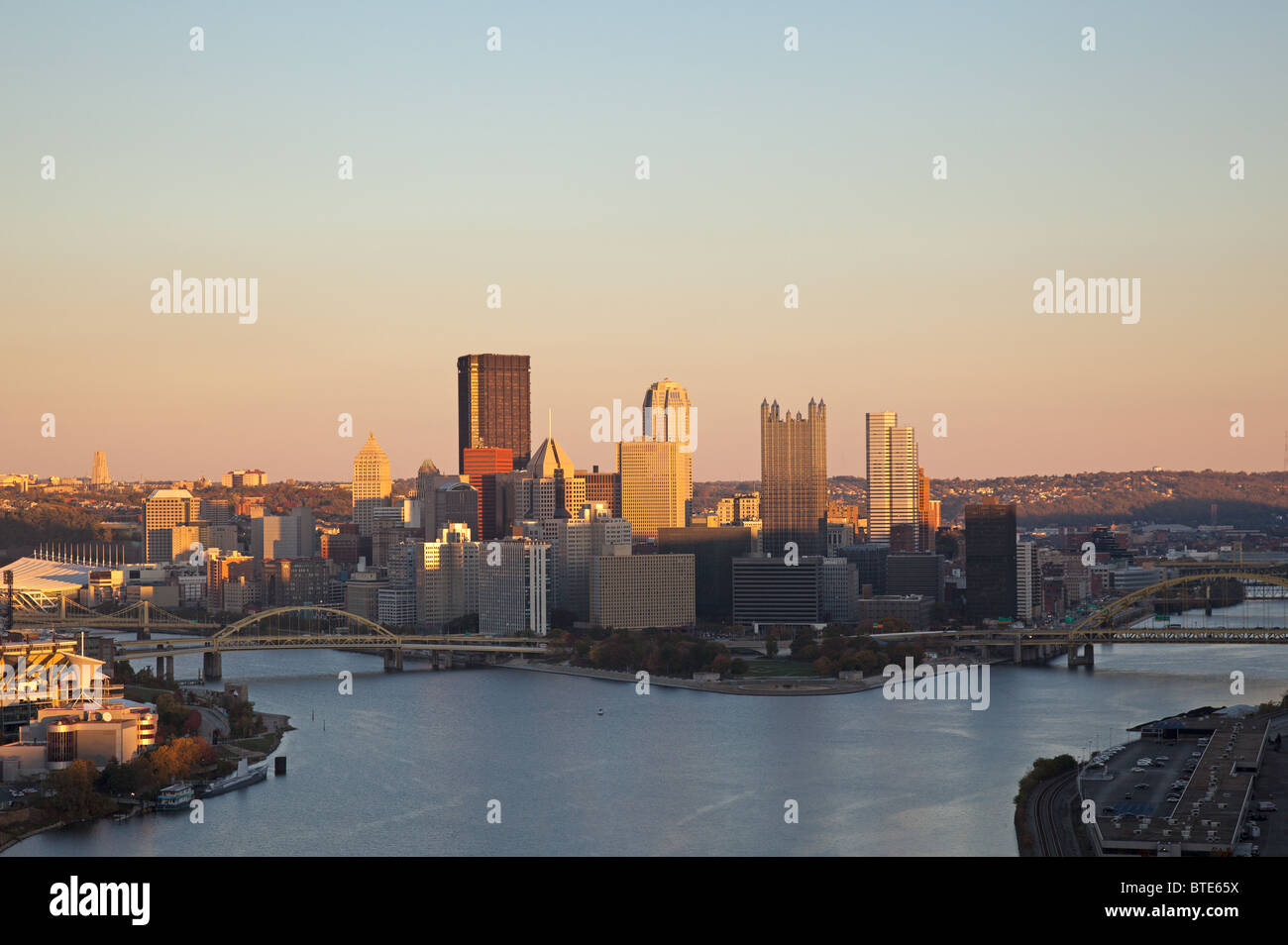 Setting sun highlights the tops of the tall buildings in downtown ...
