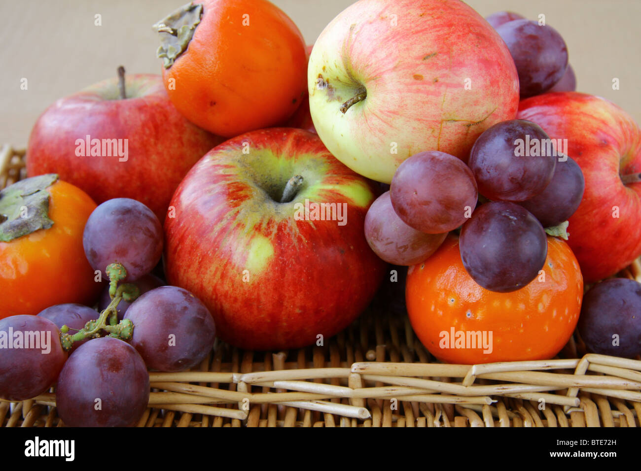 Fruity mix of many apples, persimmons, grapes Stock Photo - Alamy