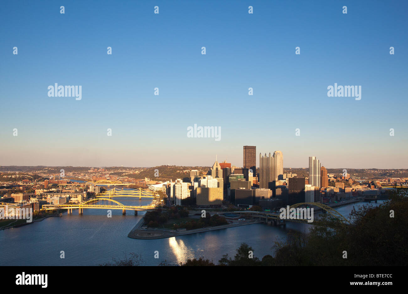 Setting sun highlights the tops of the tall buildings in downtown ...