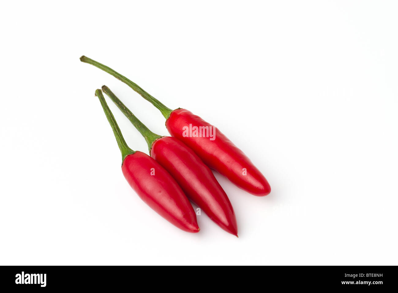 Three red chillies hi-res stock photography and images - Alamy