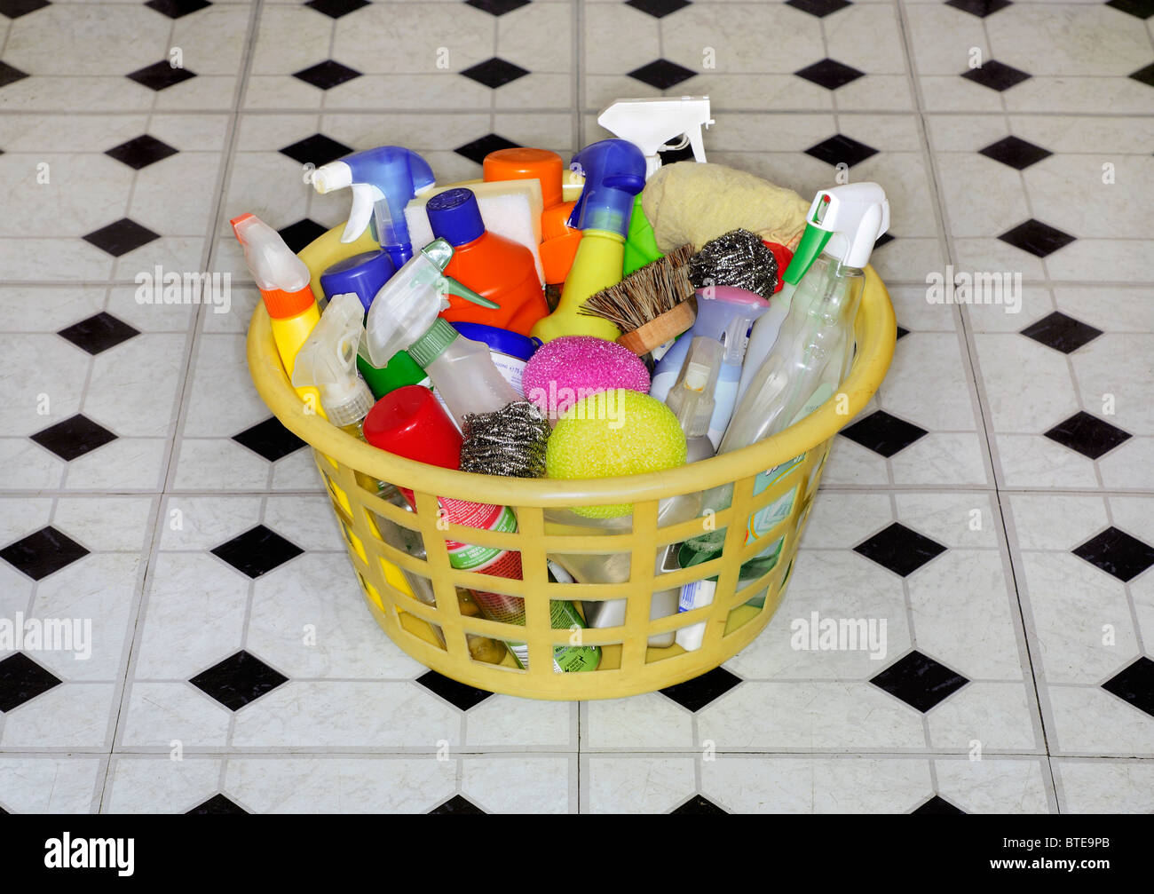Cleaning products in laundry basket Stock Photo - Alamy