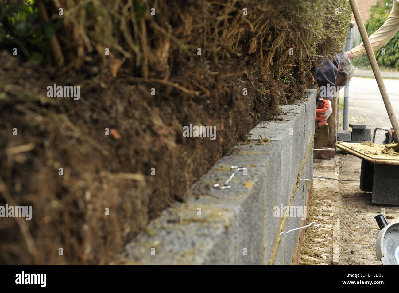 Concrete block inner garden wall with wall ties Stock Photo - Alamy