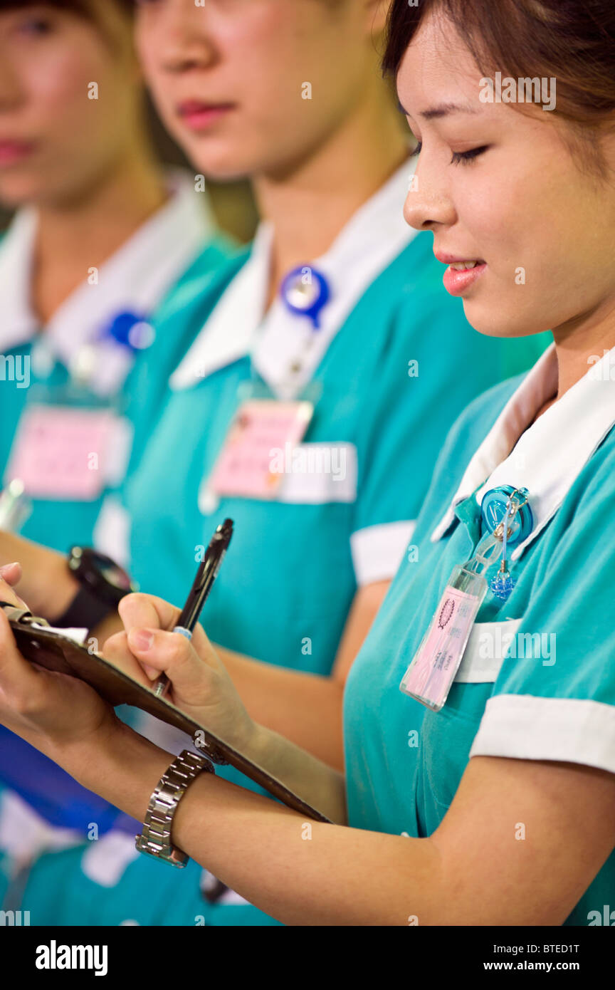 Nursing students taking notes in hospital Stock Photo - Alamy