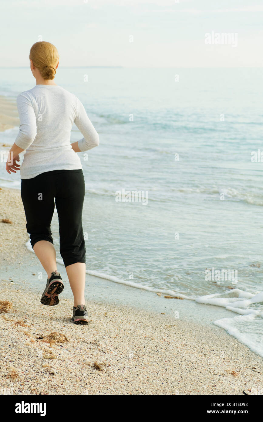 Beach running images hi-res stock photography and images - Alamy