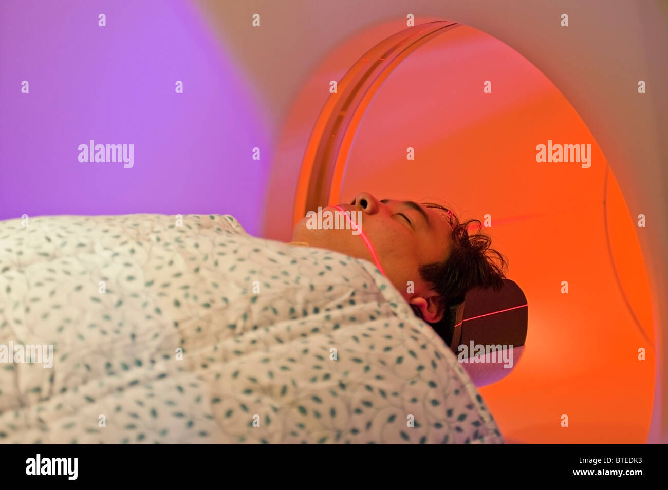 Patient having PET CT diagnostic medical scan, CAT Scan, in hospital ...