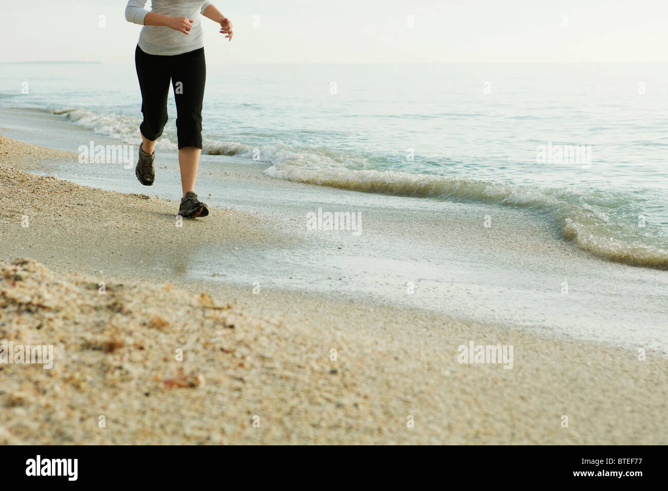Low angle shot woman jogging hi-res stock photography and images - Alamy