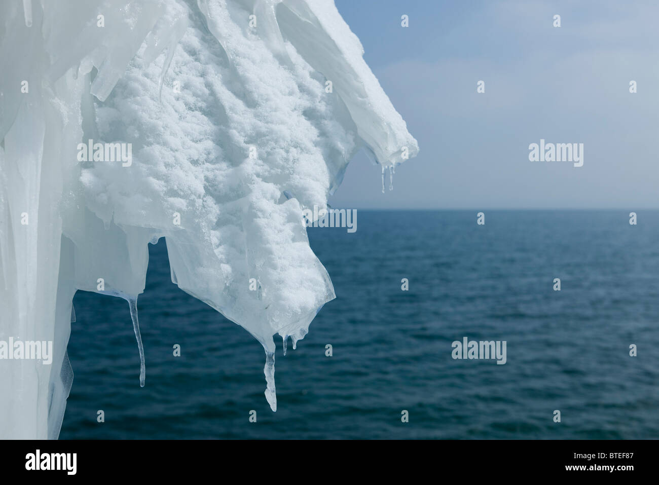 Ice hanging over lake Stock Photo - Alamy