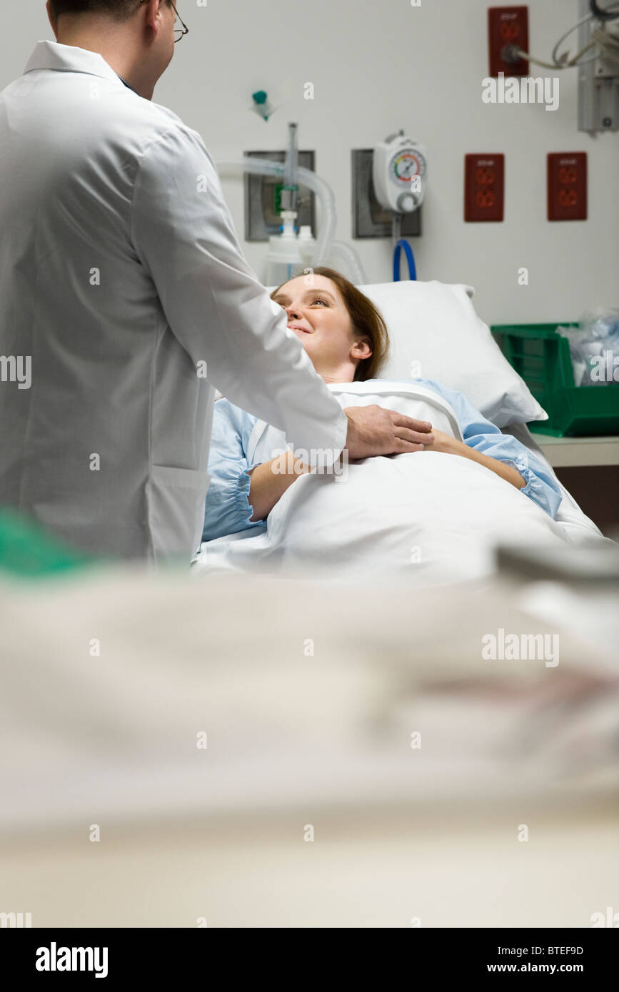 Doctor reassuring patient Stock Photo - Alamy
