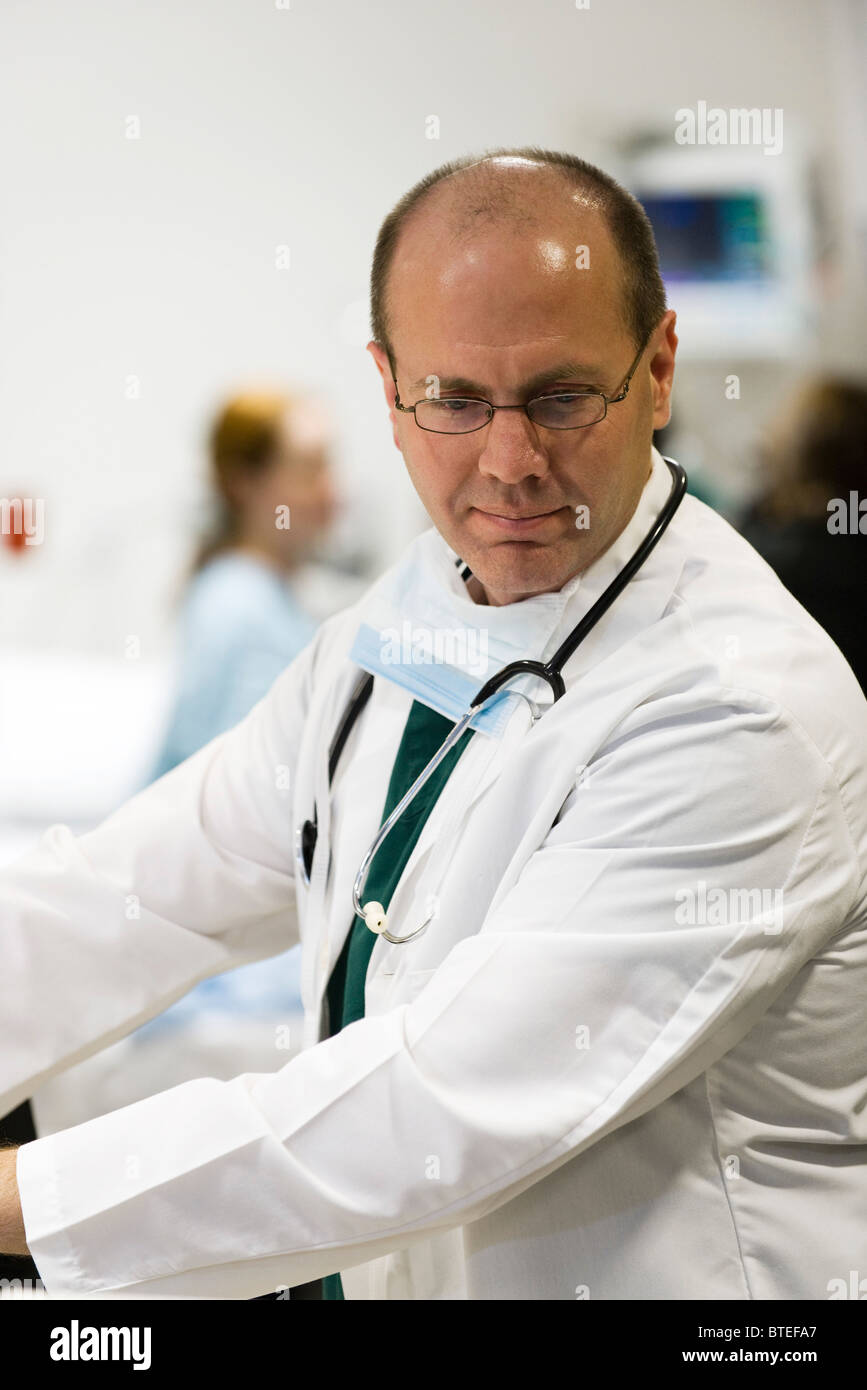 Doctor busy at work Stock Photo - Alamy