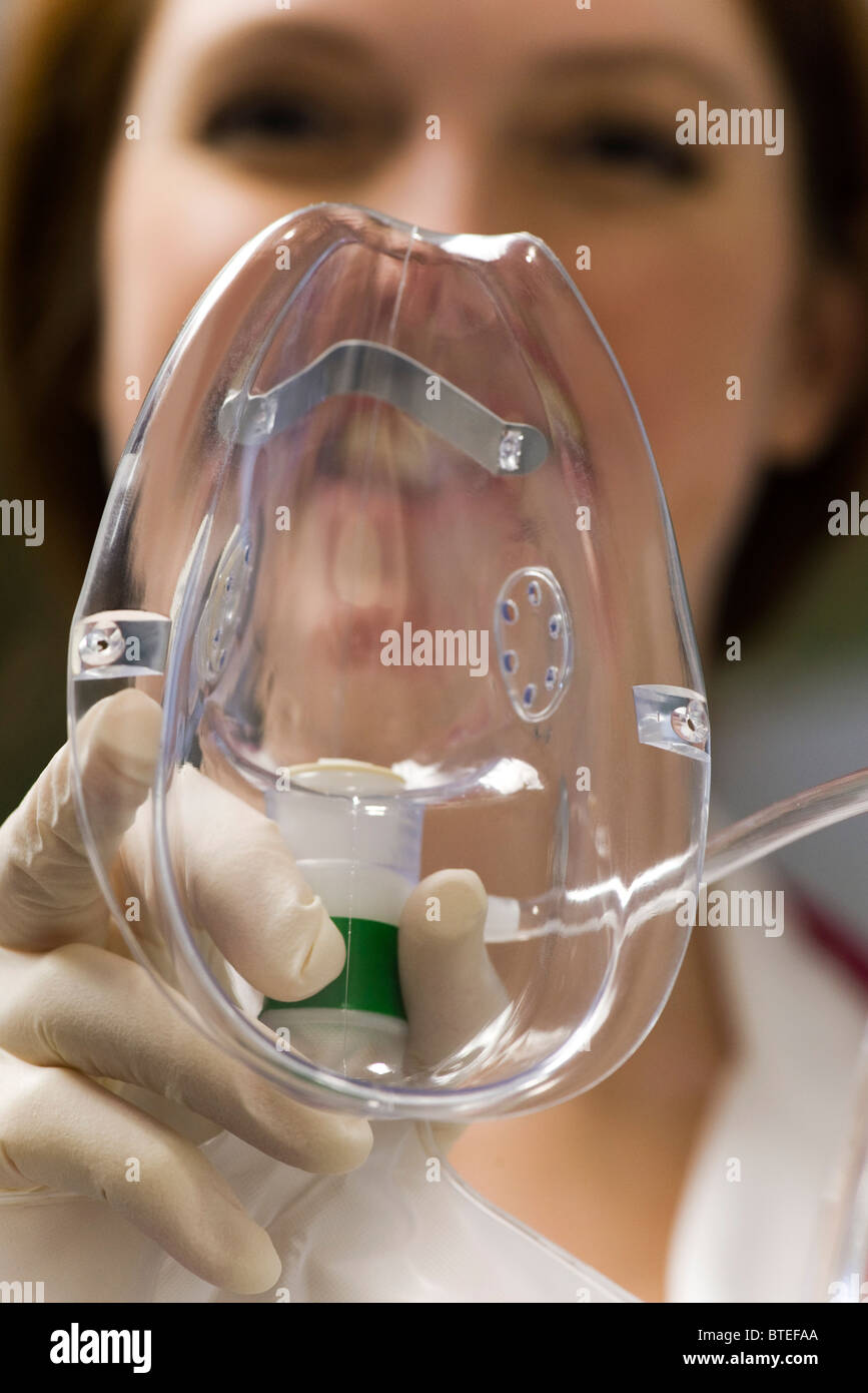 Putting oxygen mask on patient, personal perspective Stock Photo - Alamy