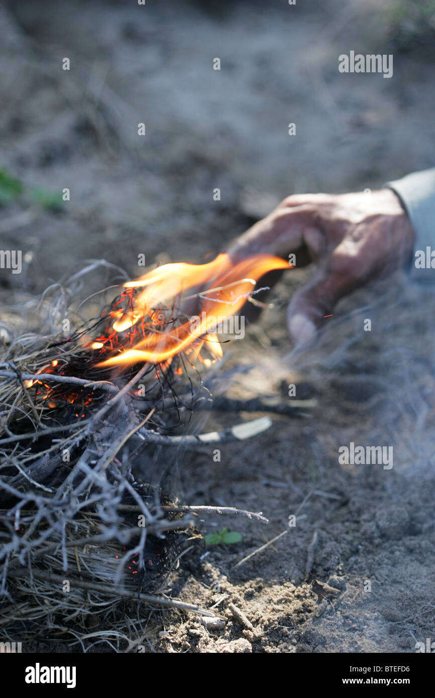 Tending fire hi-res stock photography and images - Alamy