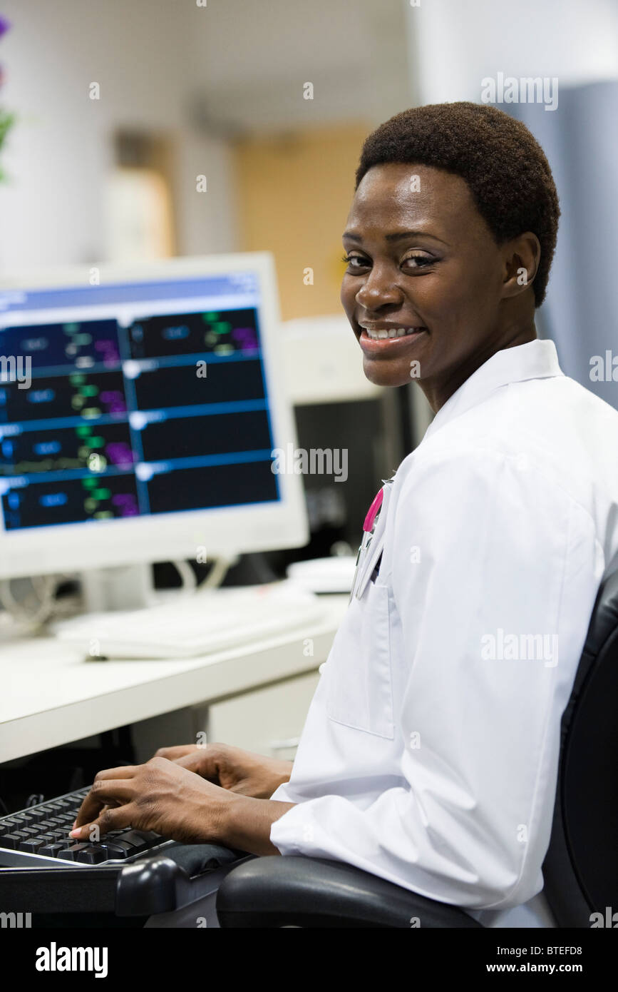 Healthcare worker using computer, portrait Stock Photo - Alamy