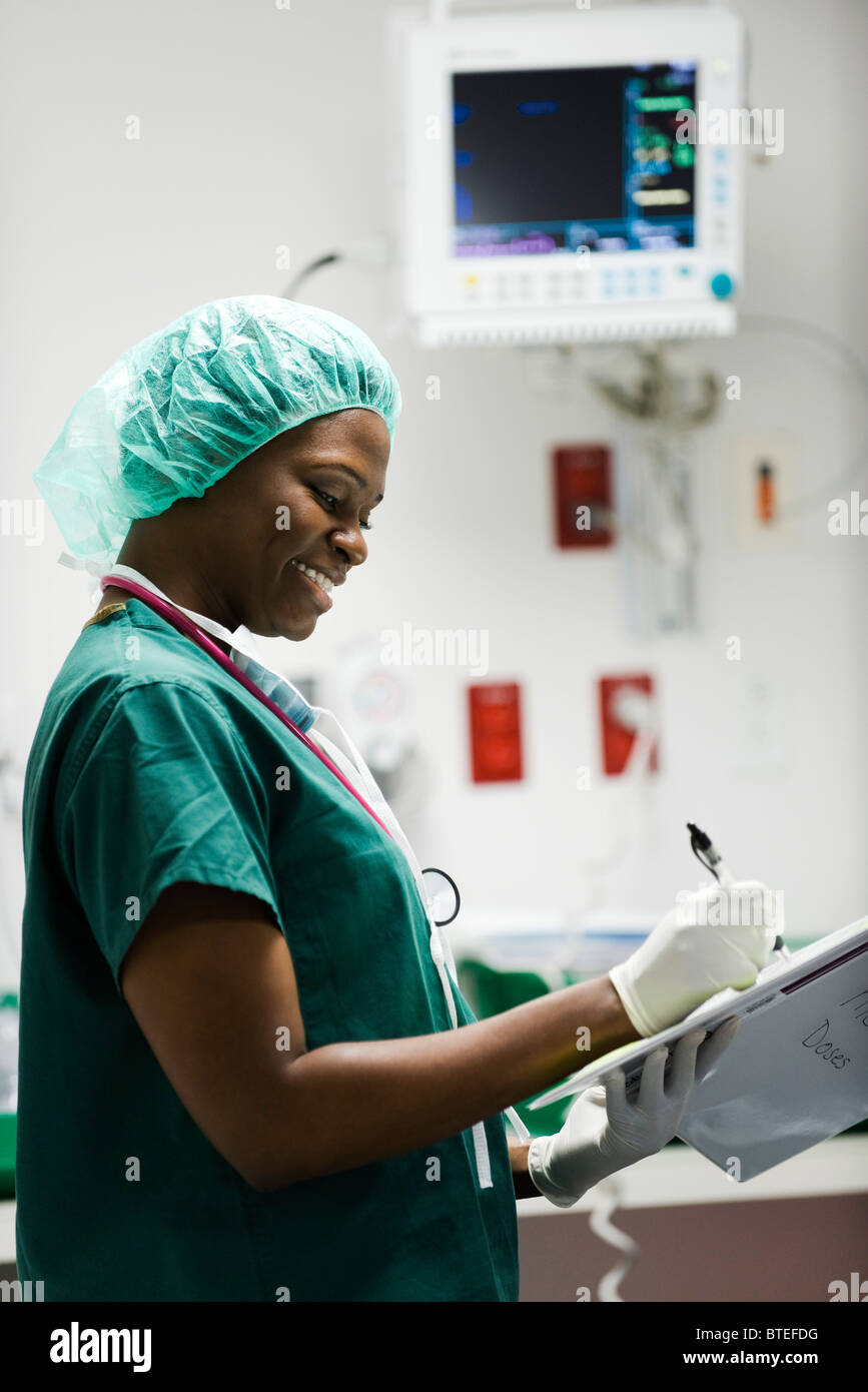Nurse at work in hospital room Stock Photo - Alamy