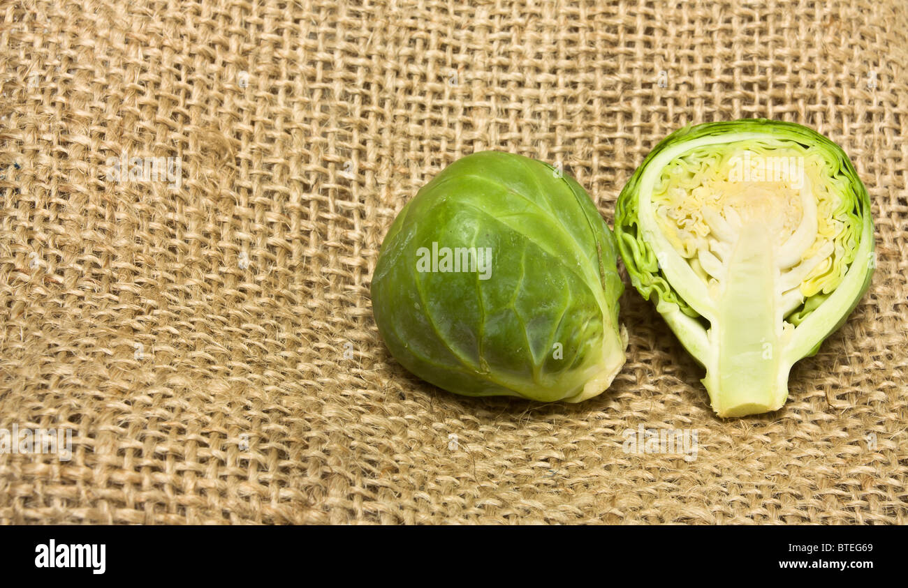 Whole and sliced Brussels Sprouts from low perspective on hessian sack ...