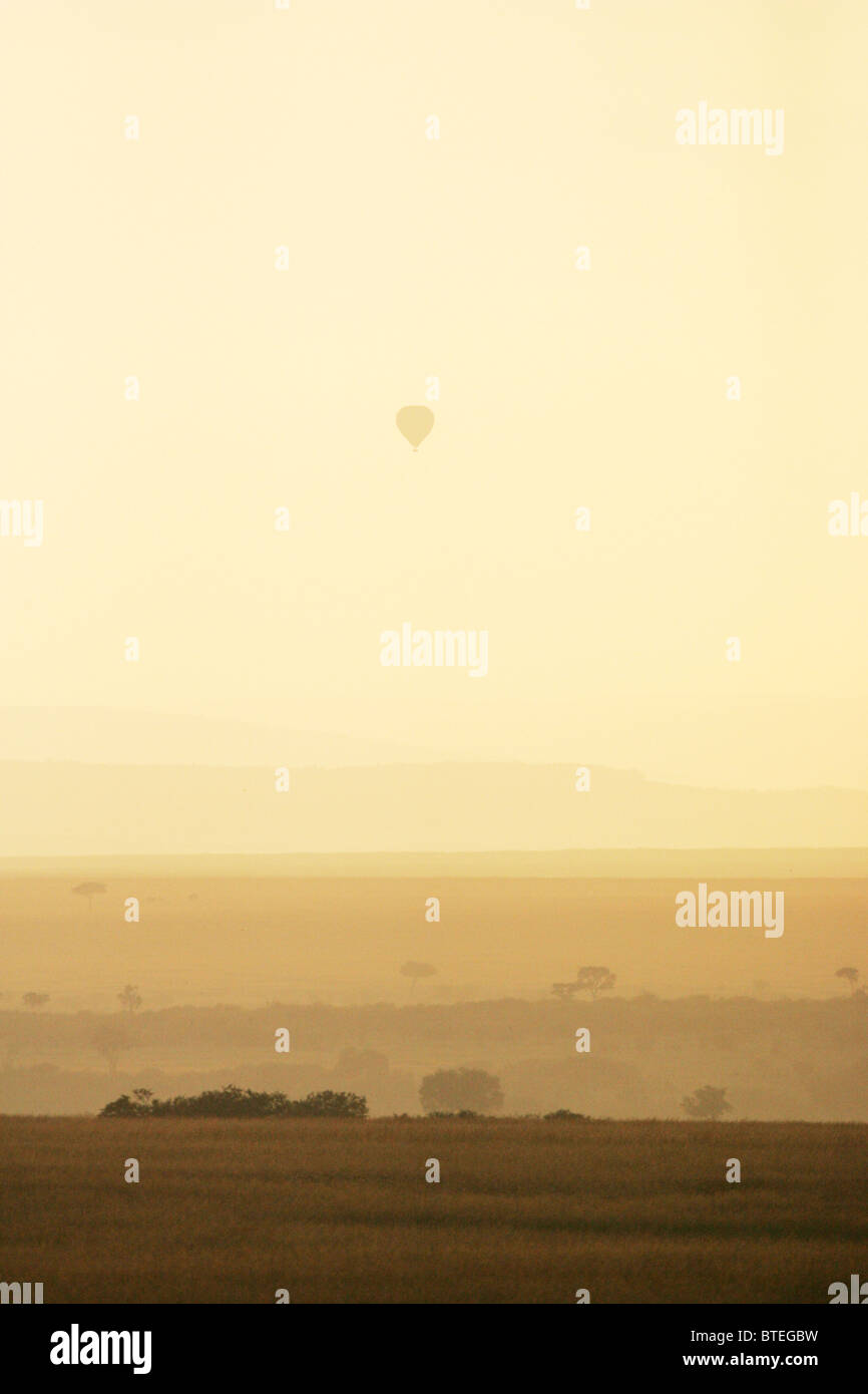 Hot air balloon in the distance at sunset Stock Photo - Alamy