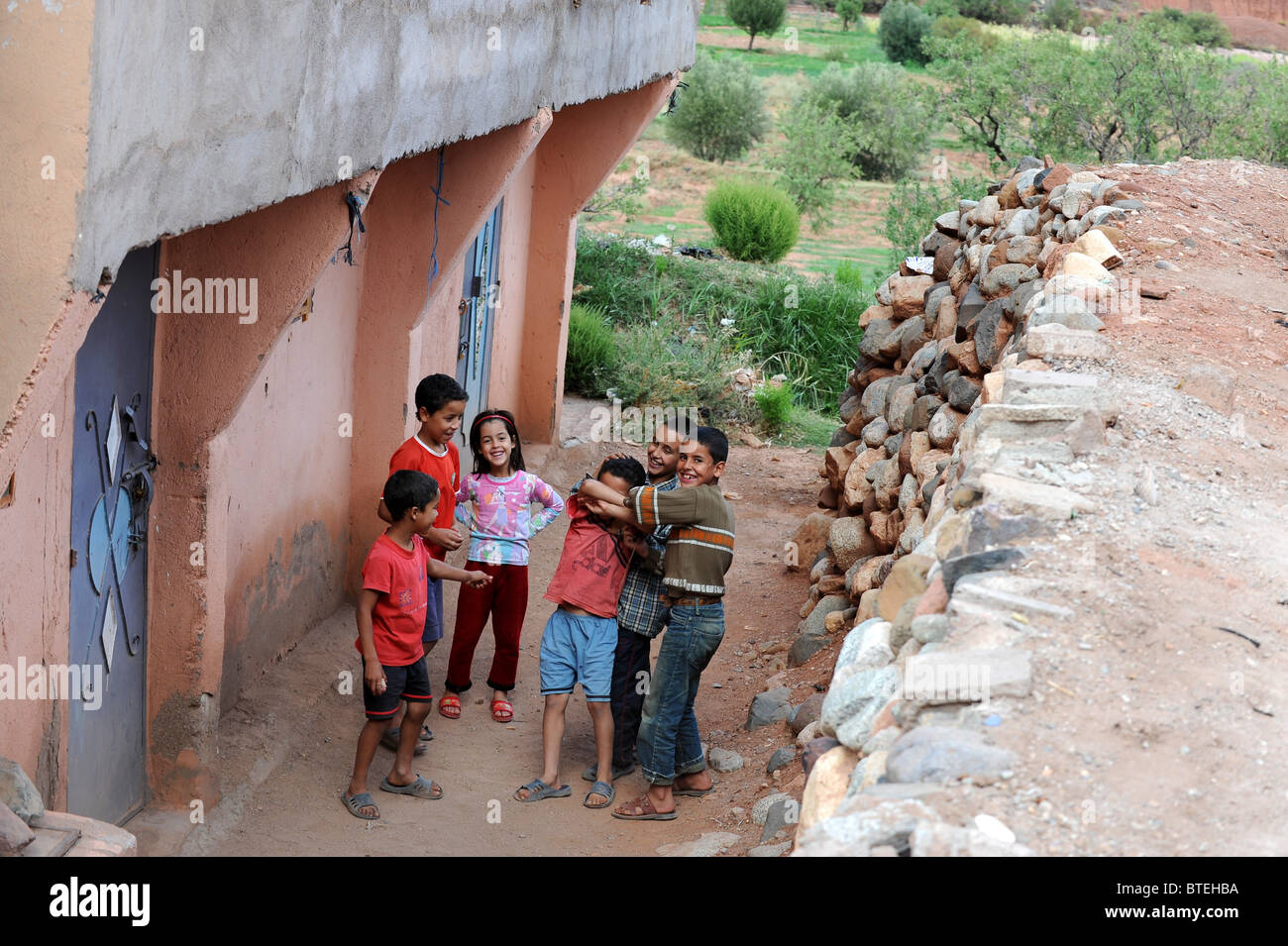 Local children having fun playing outside Stock Photo - Alamy