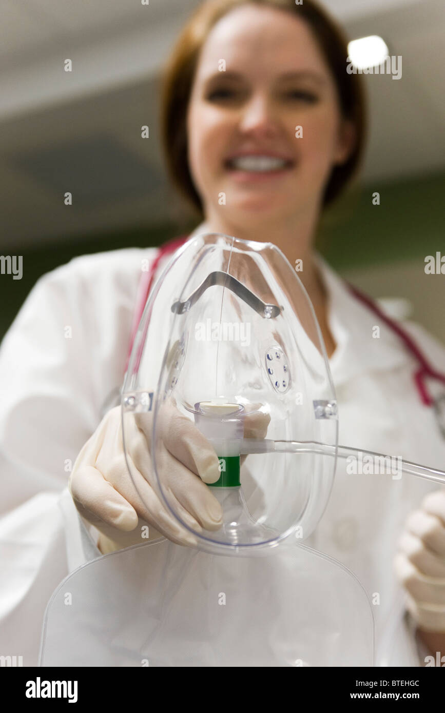 Nurse putting oxygen mask on patient, personal perspective Stock Photo ...
