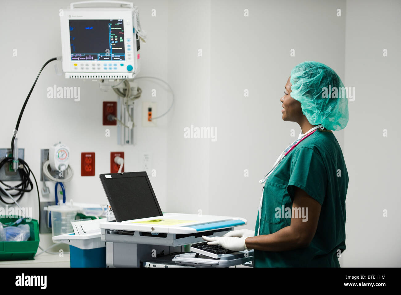 Nurse using computerized medical equipment Stock Photo - Alamy