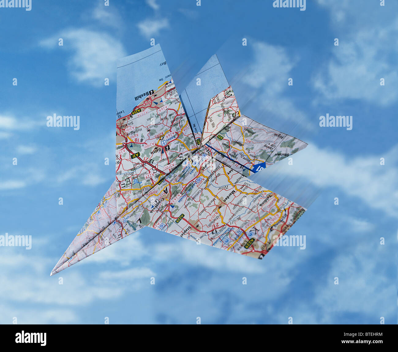 Paper Plane or Aeroplane made from a map, flying against the sky Stock ...