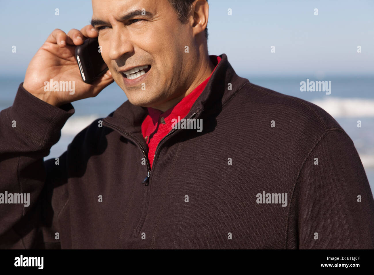 Man using cell phone outdoors Stock Photo - Alamy