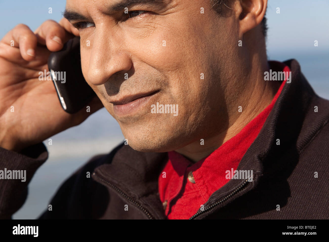 Man using cell phone outdoors Stock Photo - Alamy