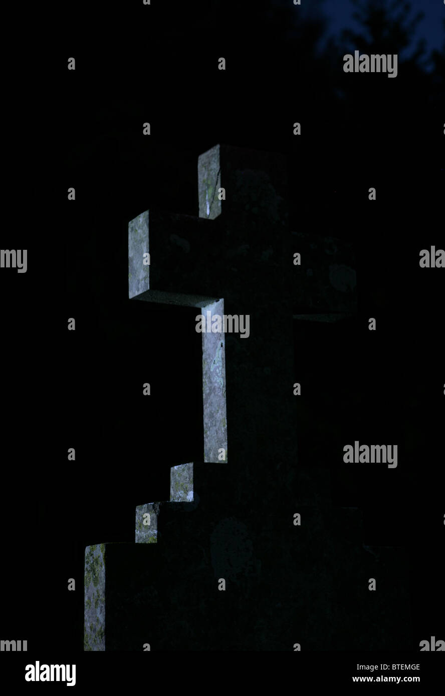 scary cross gravestone at night Stock Photo - Alamy