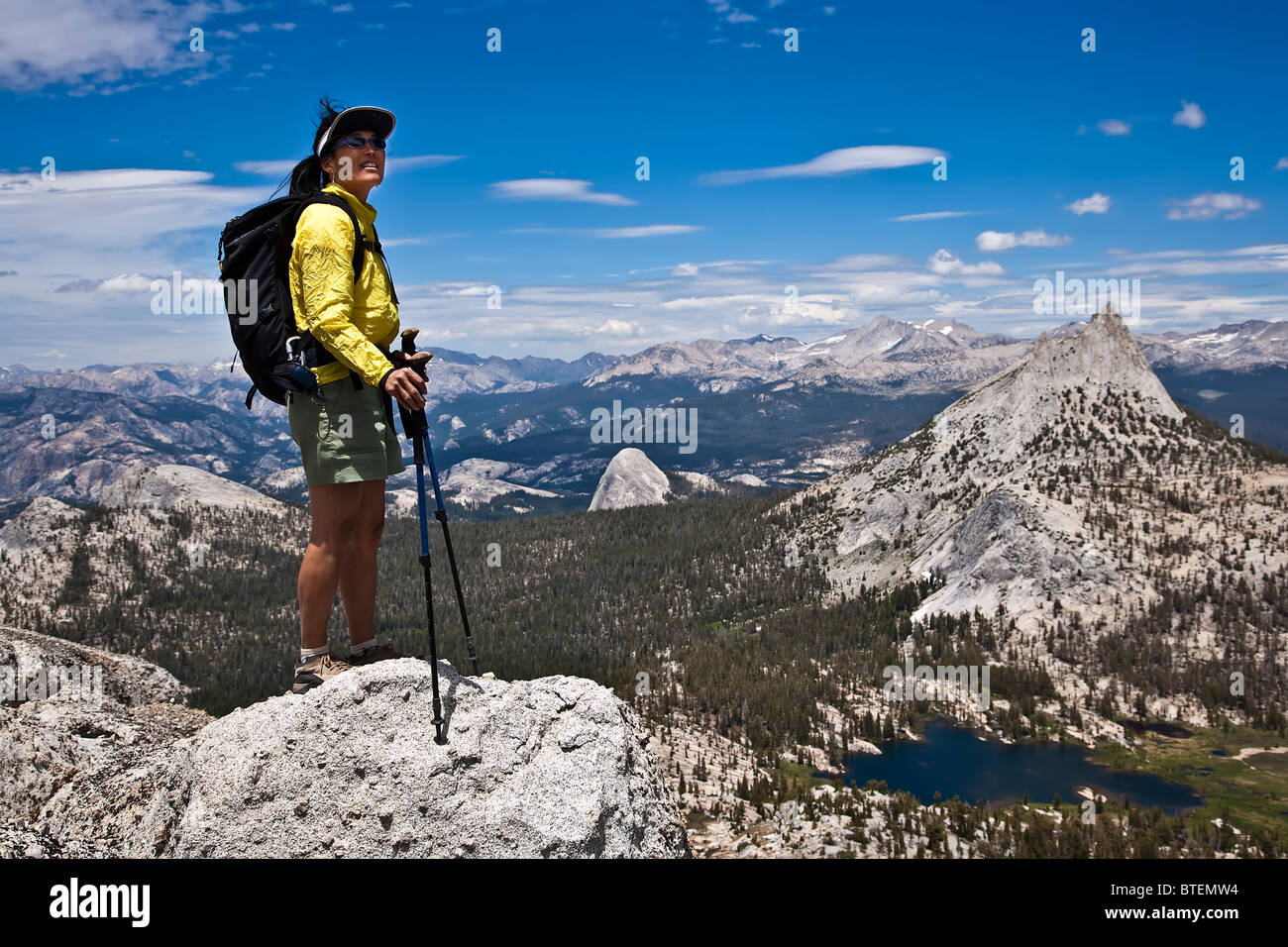 Female hiker on the summit of a rock pinnacle Stock Photo - Alamy