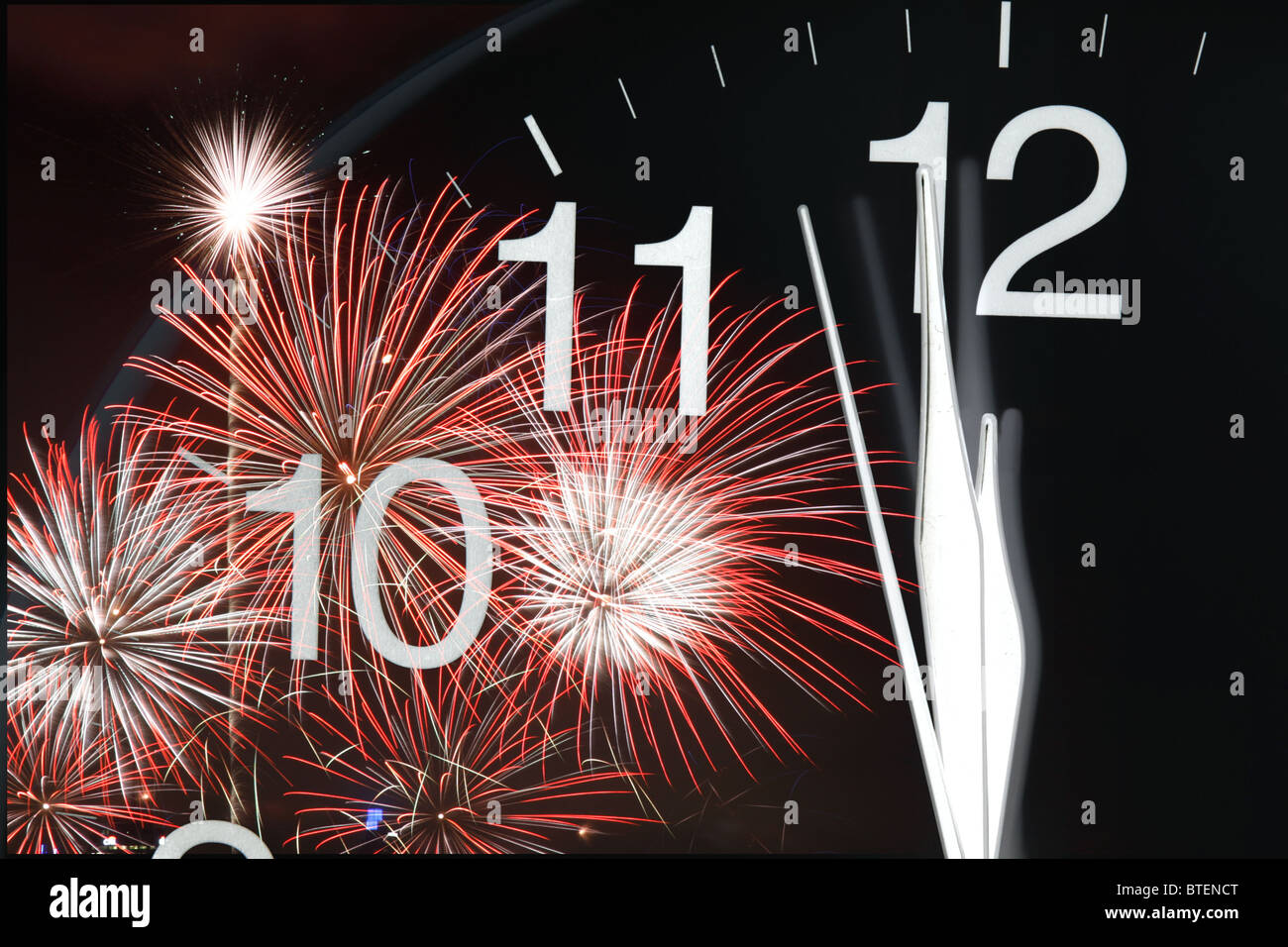 Clock and Fireworks Stock Photo - Alamy